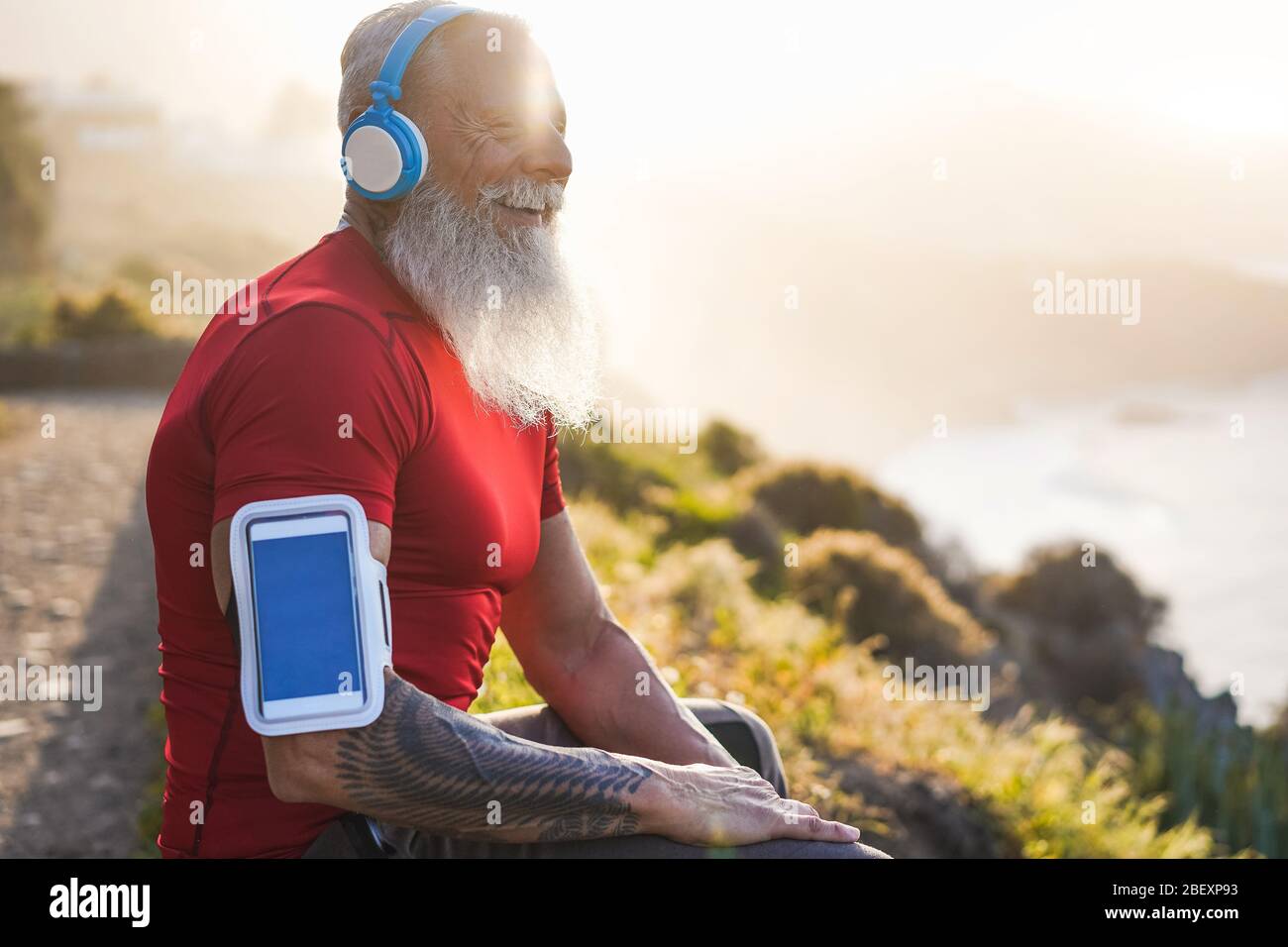 Senior fit man outdoor at sunset after workout session - Mature athlete ...