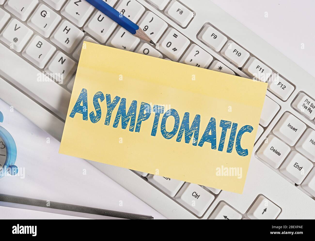 Writing note showing Asymptomatic. Business concept for a condition or ...
