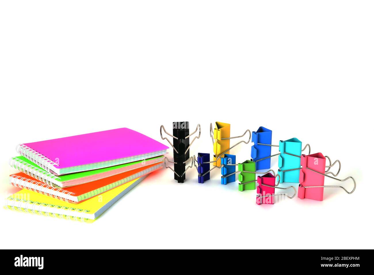Colorful notepads clip for paper on a white background in the correct ...