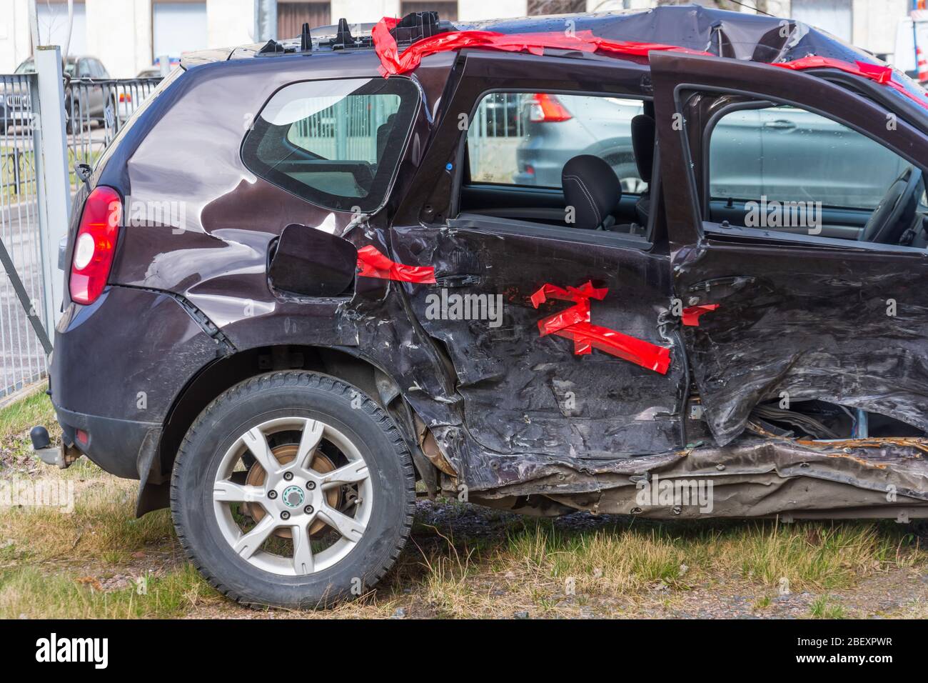 Wrecked crumpled car from the right side after a severe accident with a ...