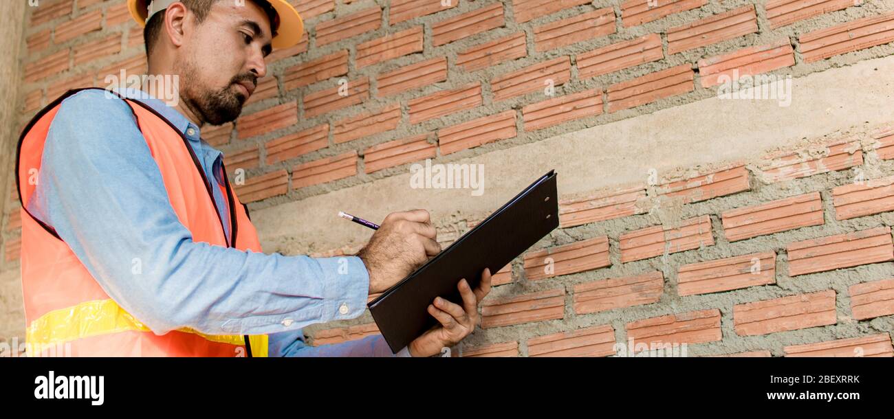 Engineer or inspector checking progressing work in construction site ...