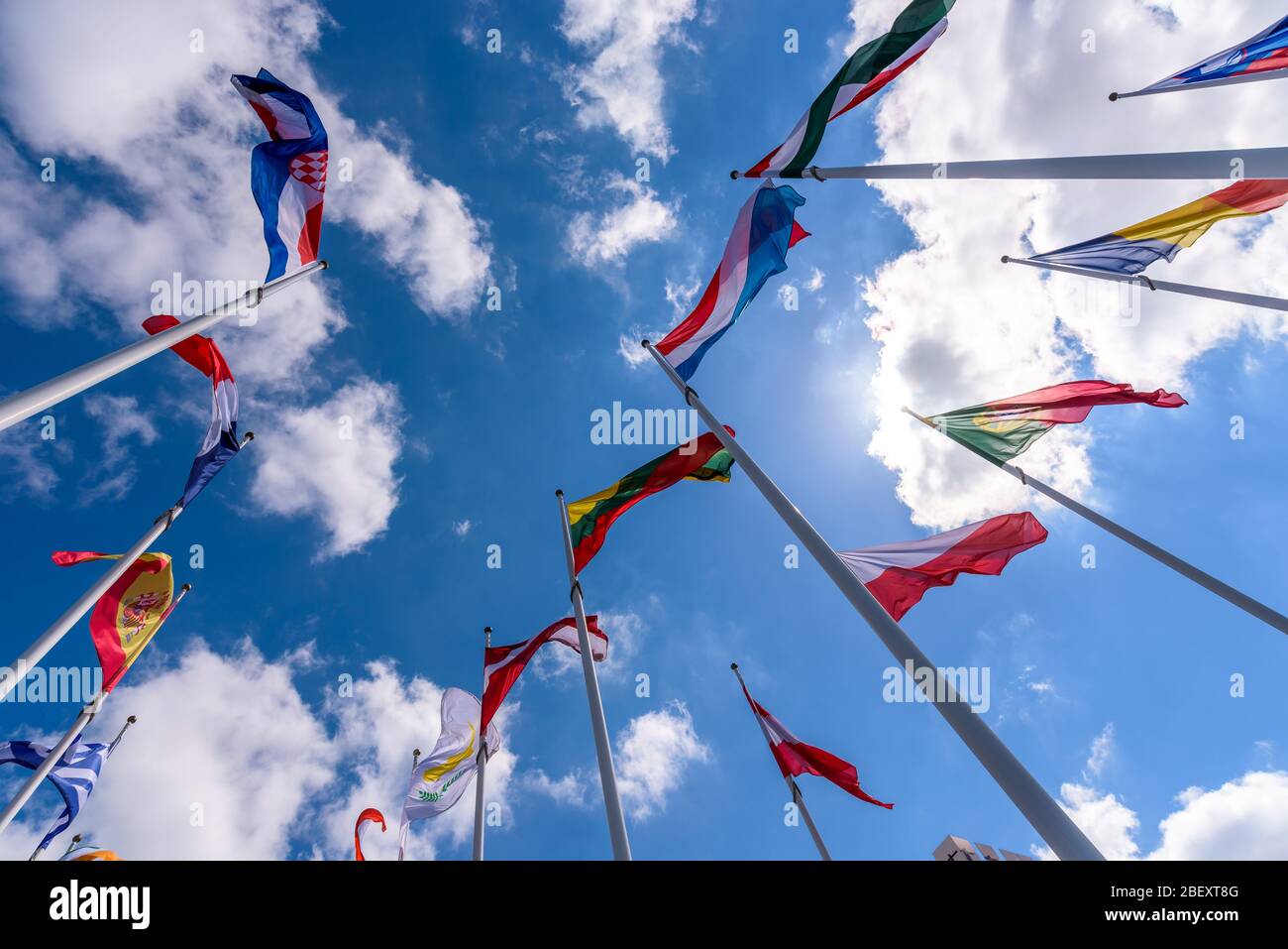 Flags of the European Union member countries waving in the wind with ...