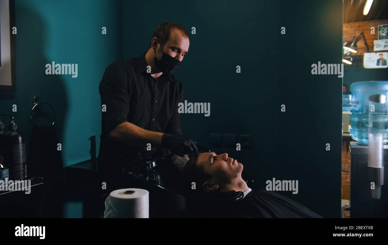 Mid adult man in barber shop hi-res stock photography and images - Alamy