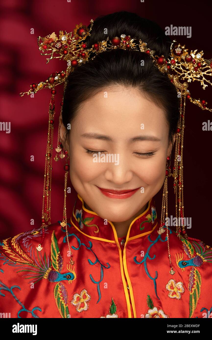 Happy Chinese bride smile with his eyes closed Stock Photo - Alamy