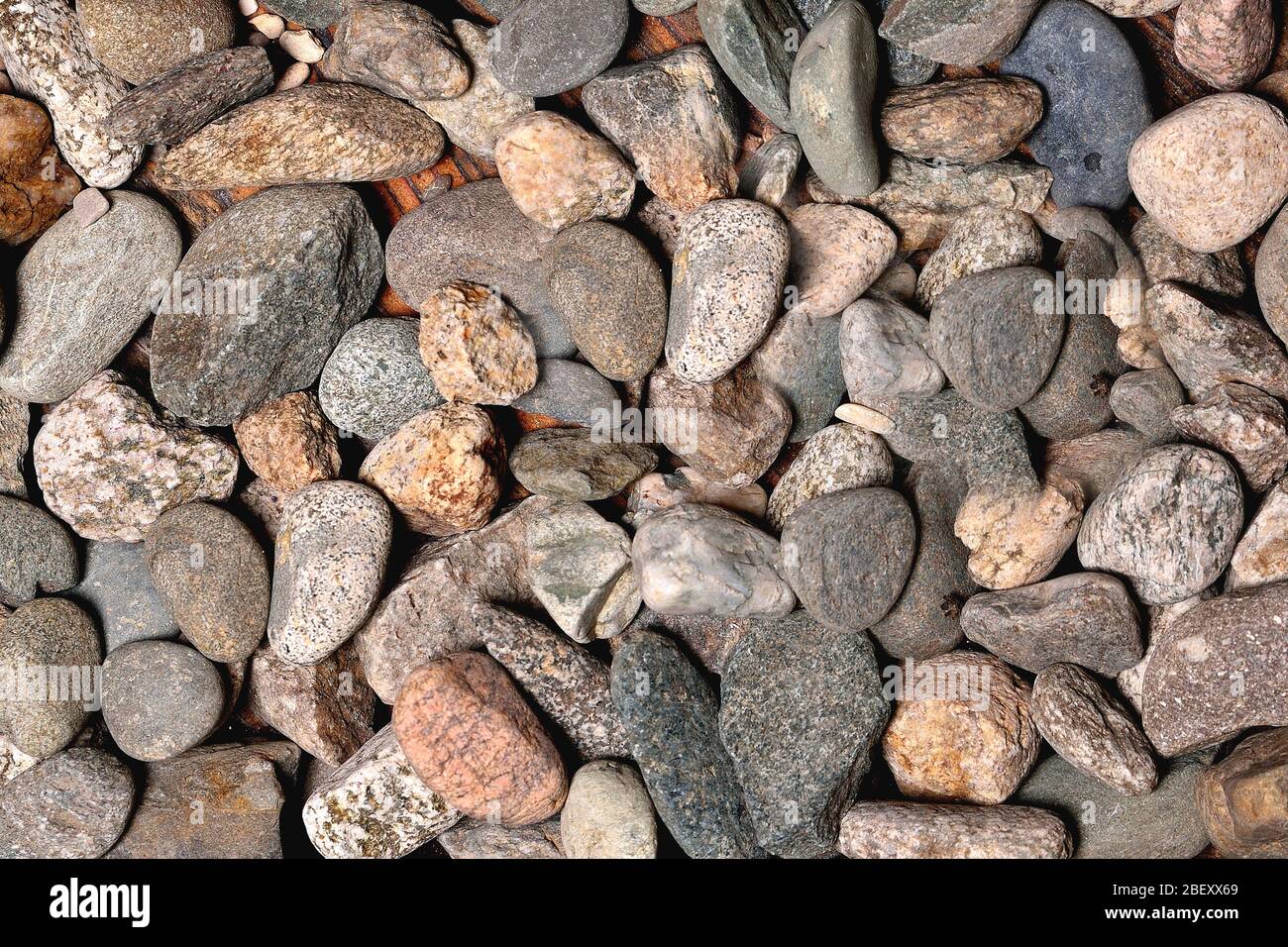 gray rounded stones of heterogeneous structure, background Stock Photo ...