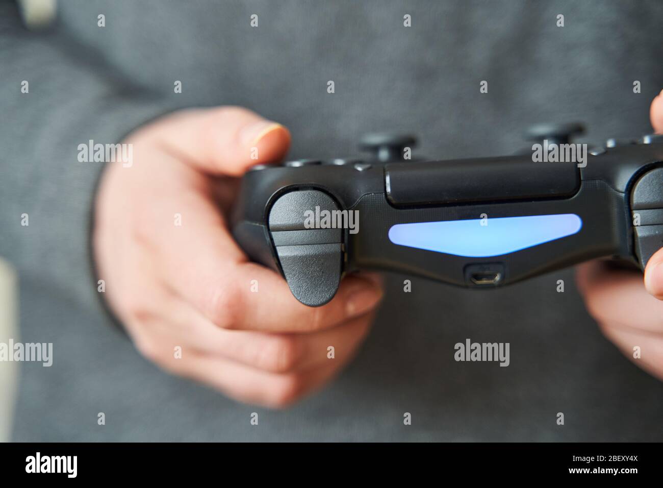 Joystick for game console. The girl plays in the console. Close-up ...