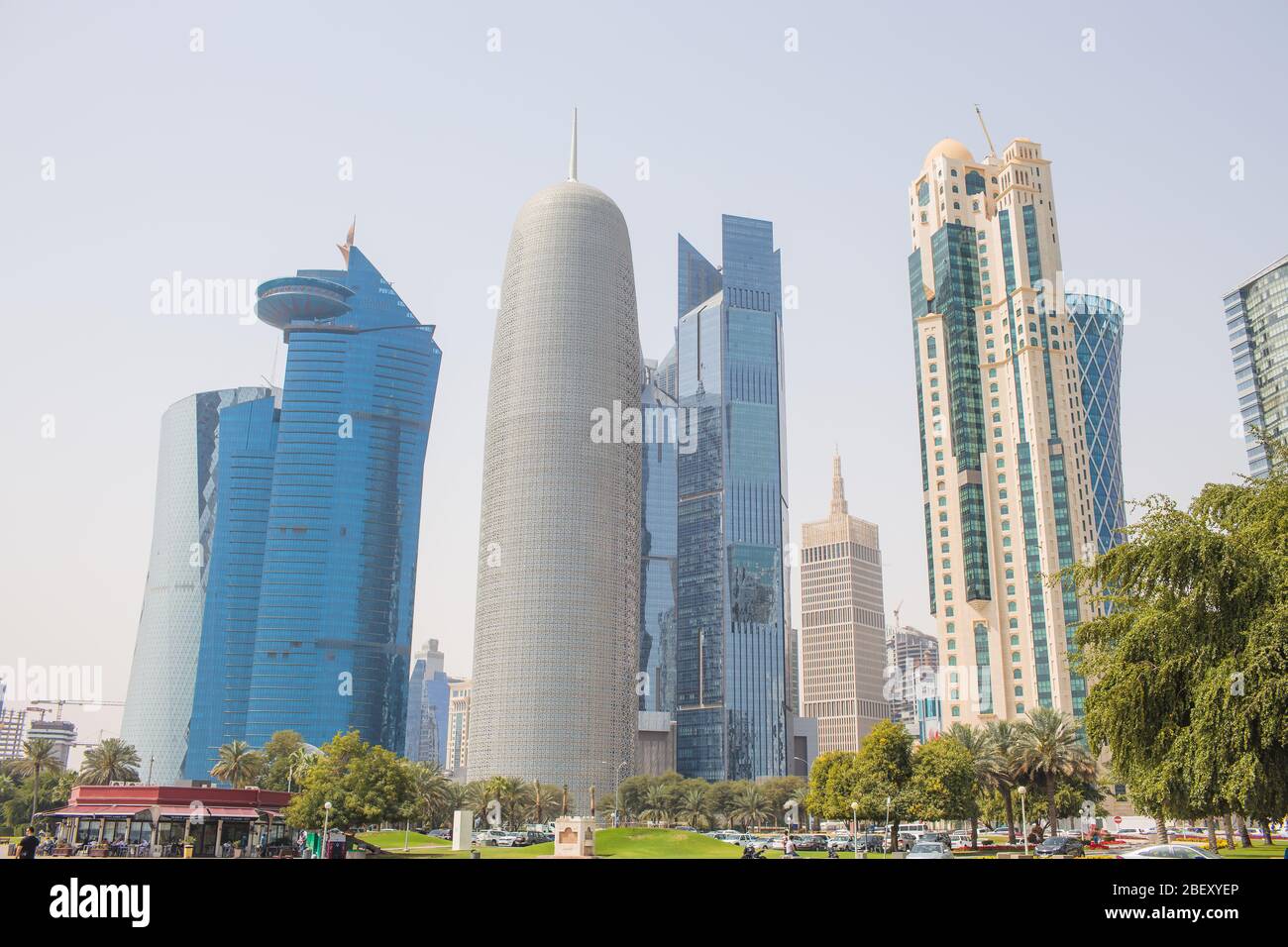 A dhow passes beneath some of the most massive buildings in Doha, Qatar ...