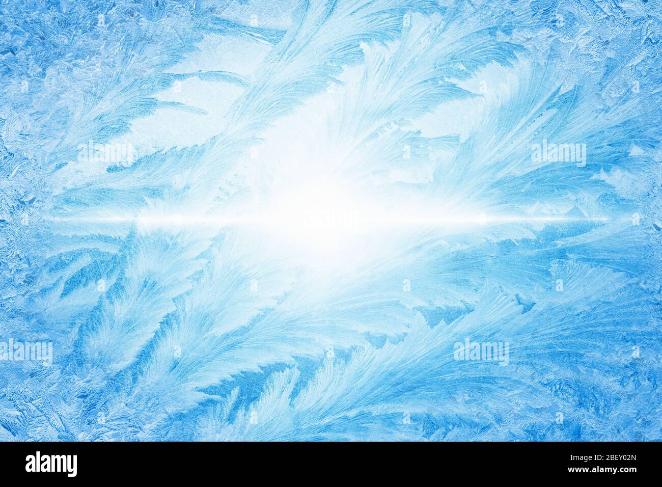 Winter seasonal background - bright sun shines through frozen icy ...