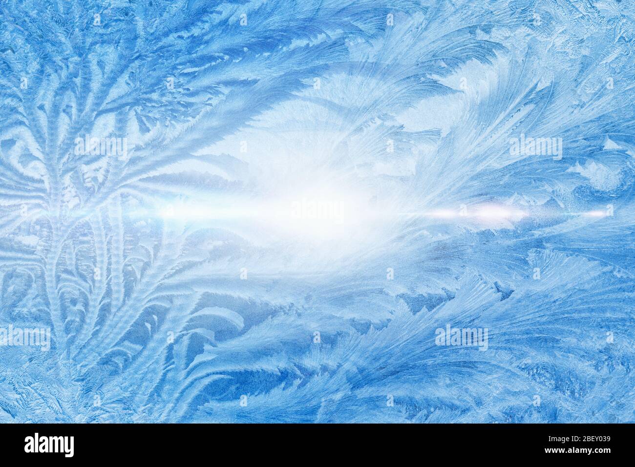 Winter seasonal background - bright sun shines through frozen icy ...