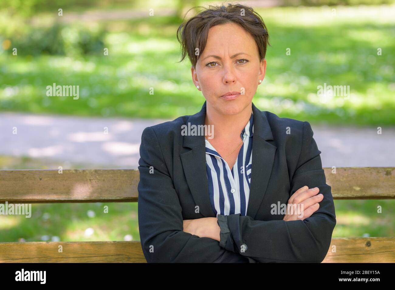 Sceptical Hispanic woman frowning at the camera with a puzzled ...