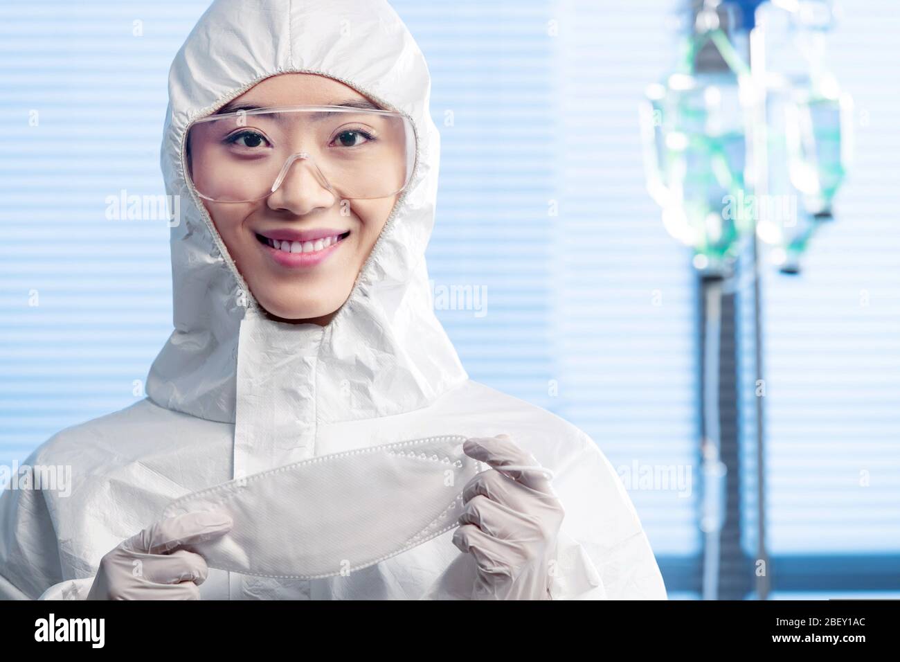 Remove the mask smile's medical workers Stock Photo - Alamy