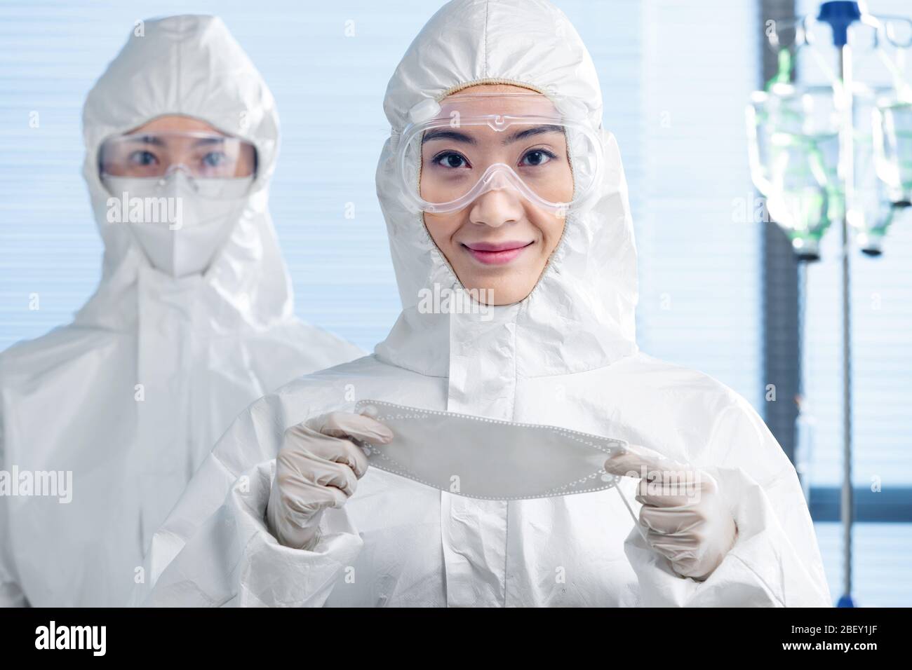 Remove the mask smile's medical workers Stock Photo - Alamy