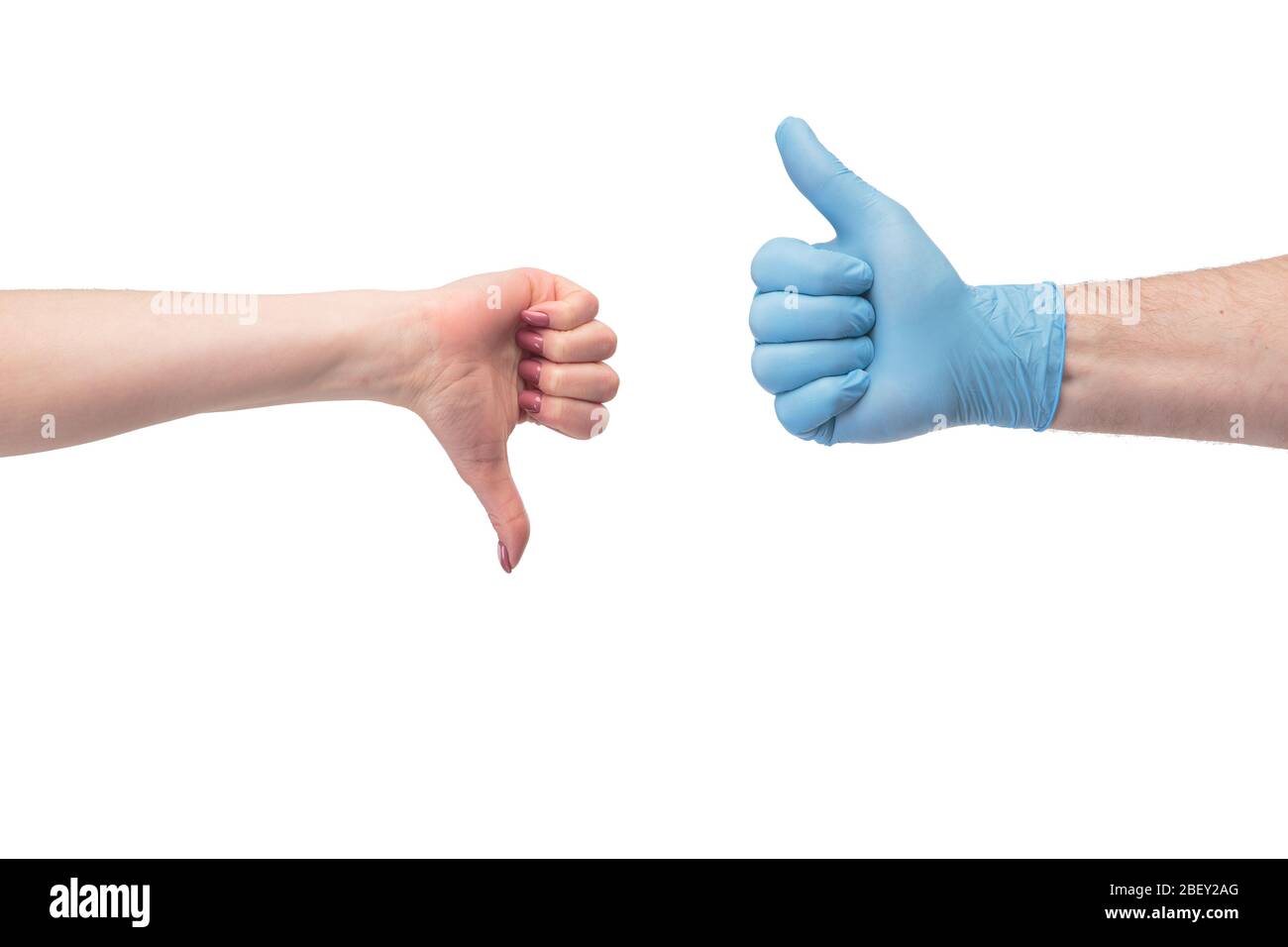 Hand in gloves thumb up over white Stock Photo - Alamy