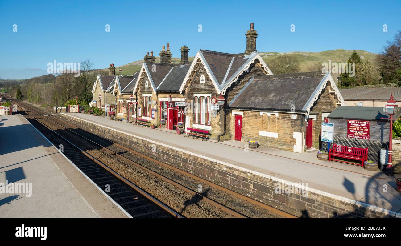 The traditionally styled footbridge and train station at Settle on the ...