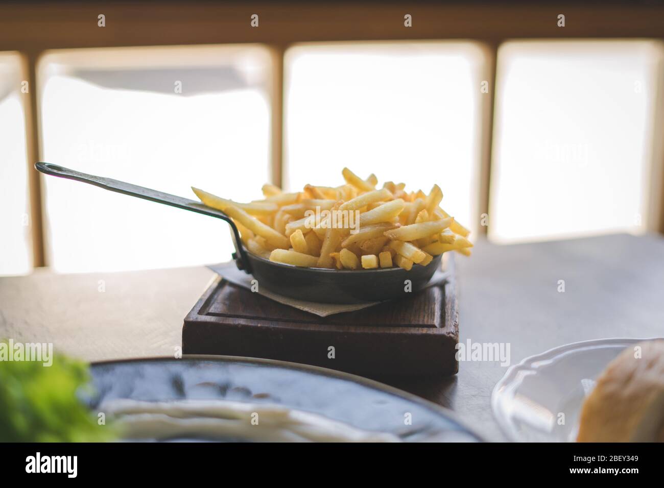 French fries in pan in restaurant. Delicious french fries Stock Photo ...