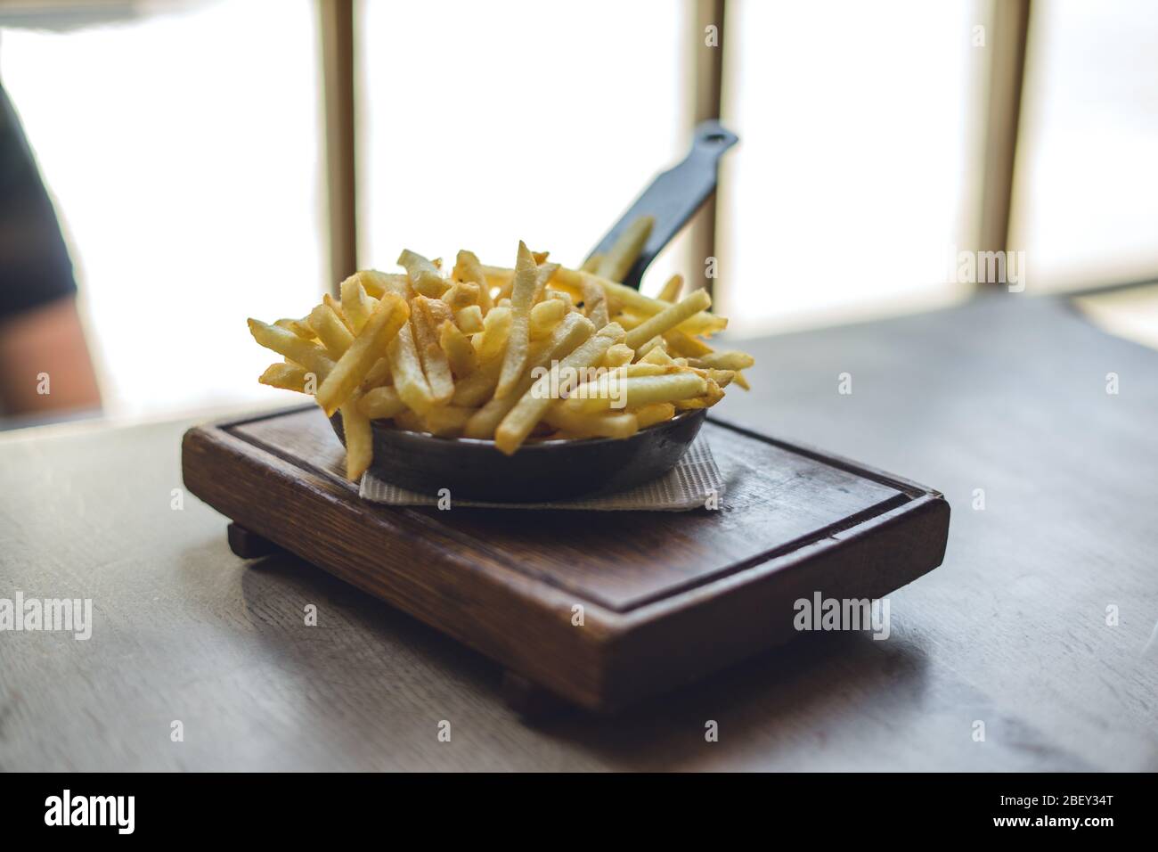 French fries in pan in restaurant. Delicious french fries Stock Photo ...