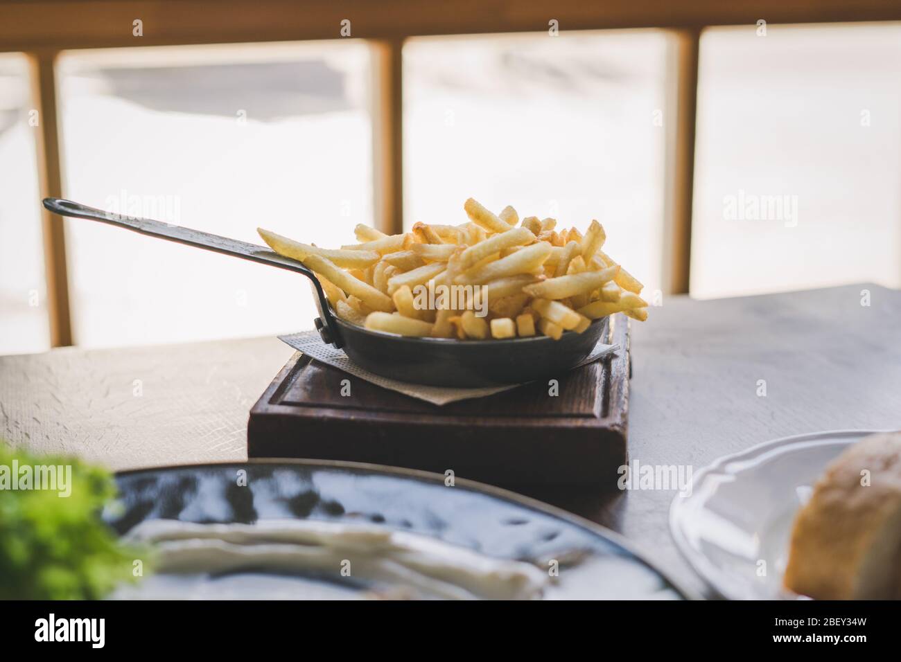 French fries in pan in restaurant. Delicious french fries Stock Photo ...