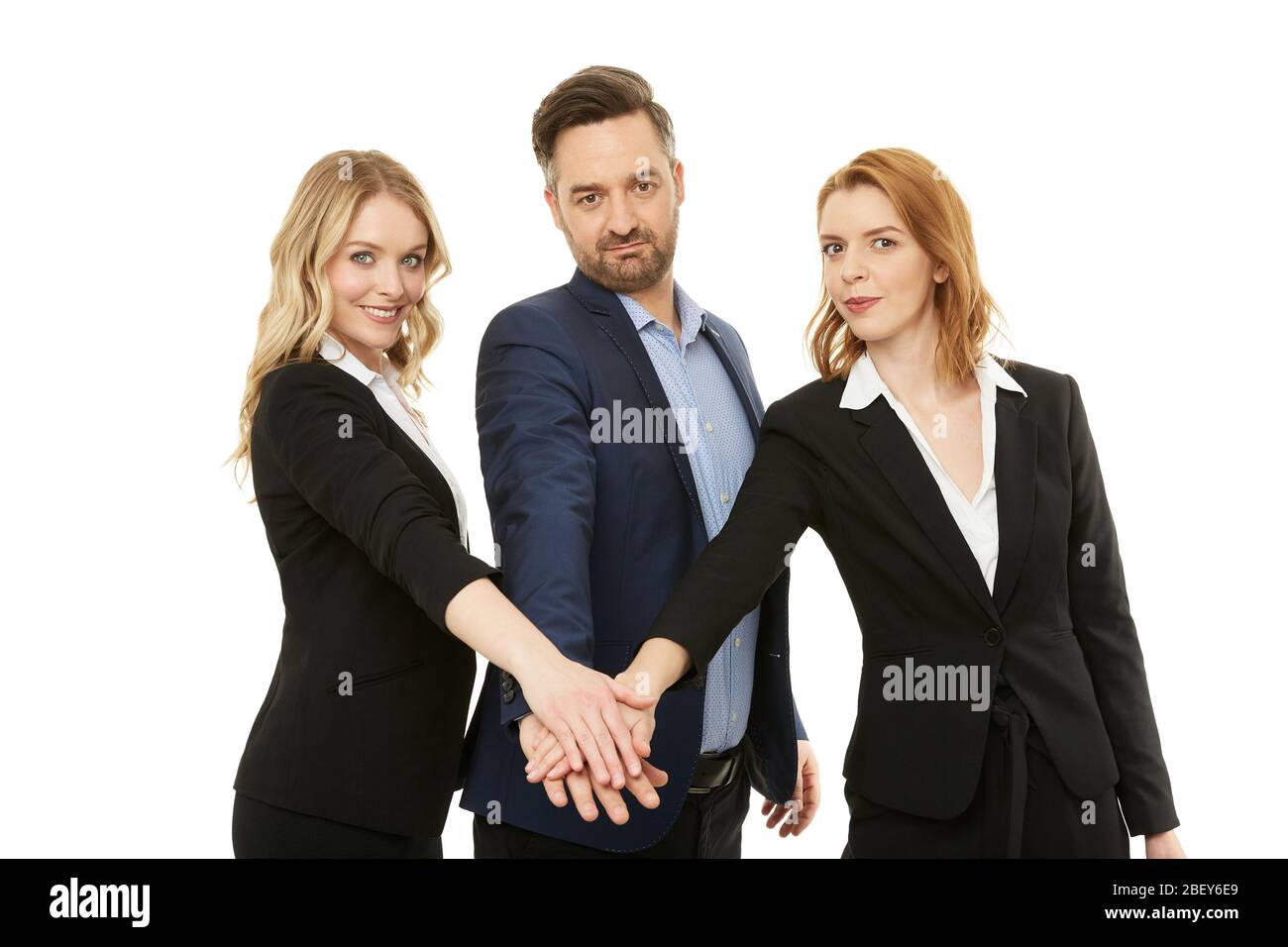 Businessman with two beautiful businesswomen. Teamwork Stock Photo - Alamy