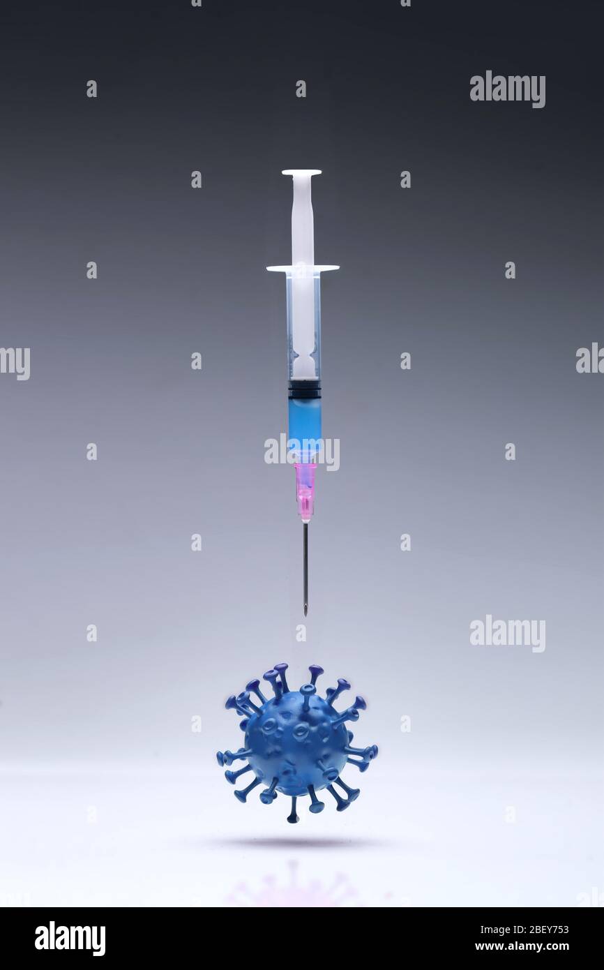 Syringes and virus Stock Photo - Alamy