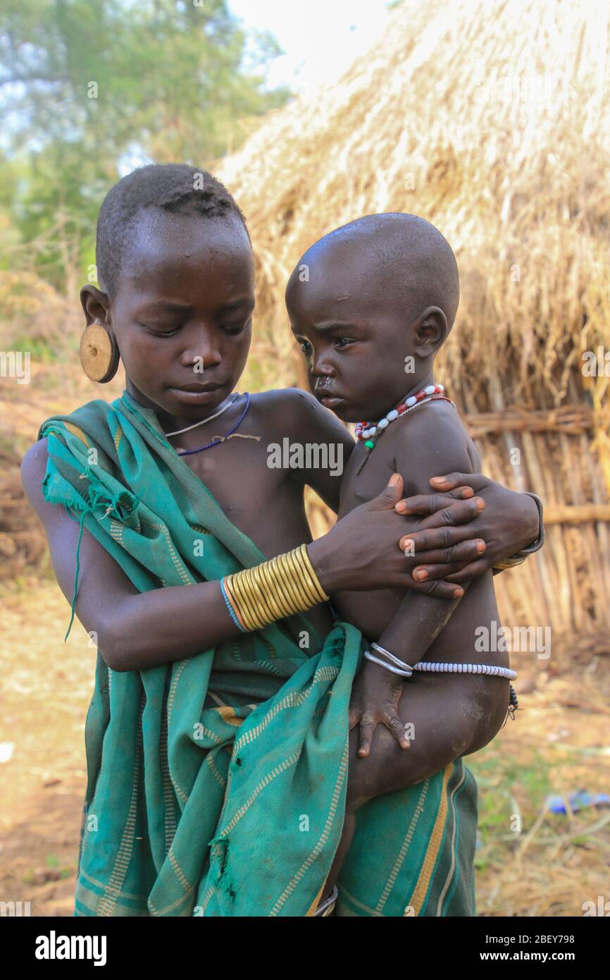 Children of the Mursi tribe. A nomadic cattle herder ethnic group ...