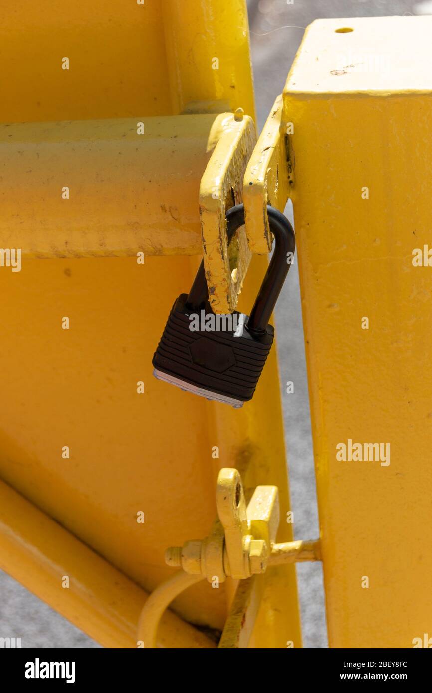 a close up view of a yellow metal boom that has been locked Stock Photo ...