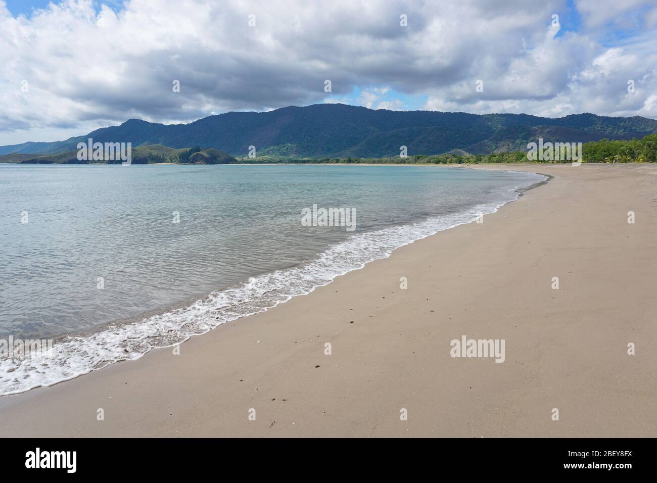Sandy beach shore in New Caledonia, West coast of Grande-Terre island ...