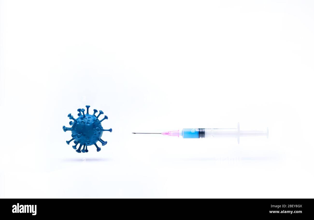 Syringes and virus Stock Photo - Alamy