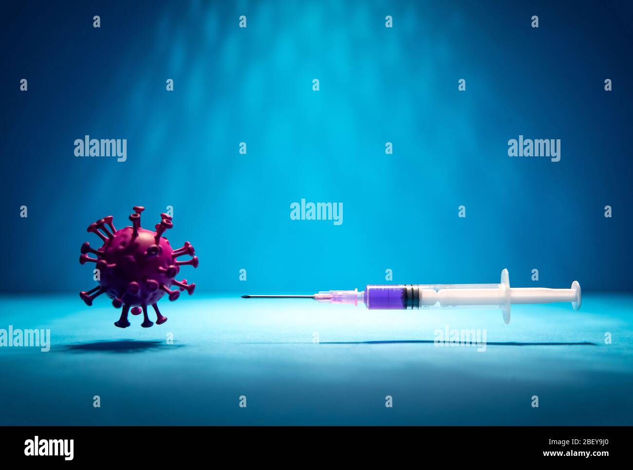 Syringes and virus Stock Photo - Alamy