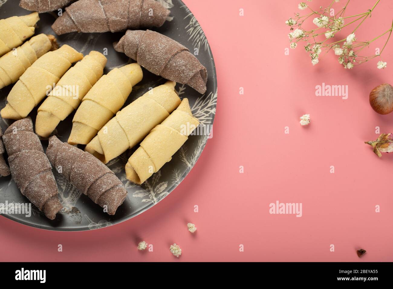 Traditional caucasian sweets mutaki with cocoa dough in a black platter ...