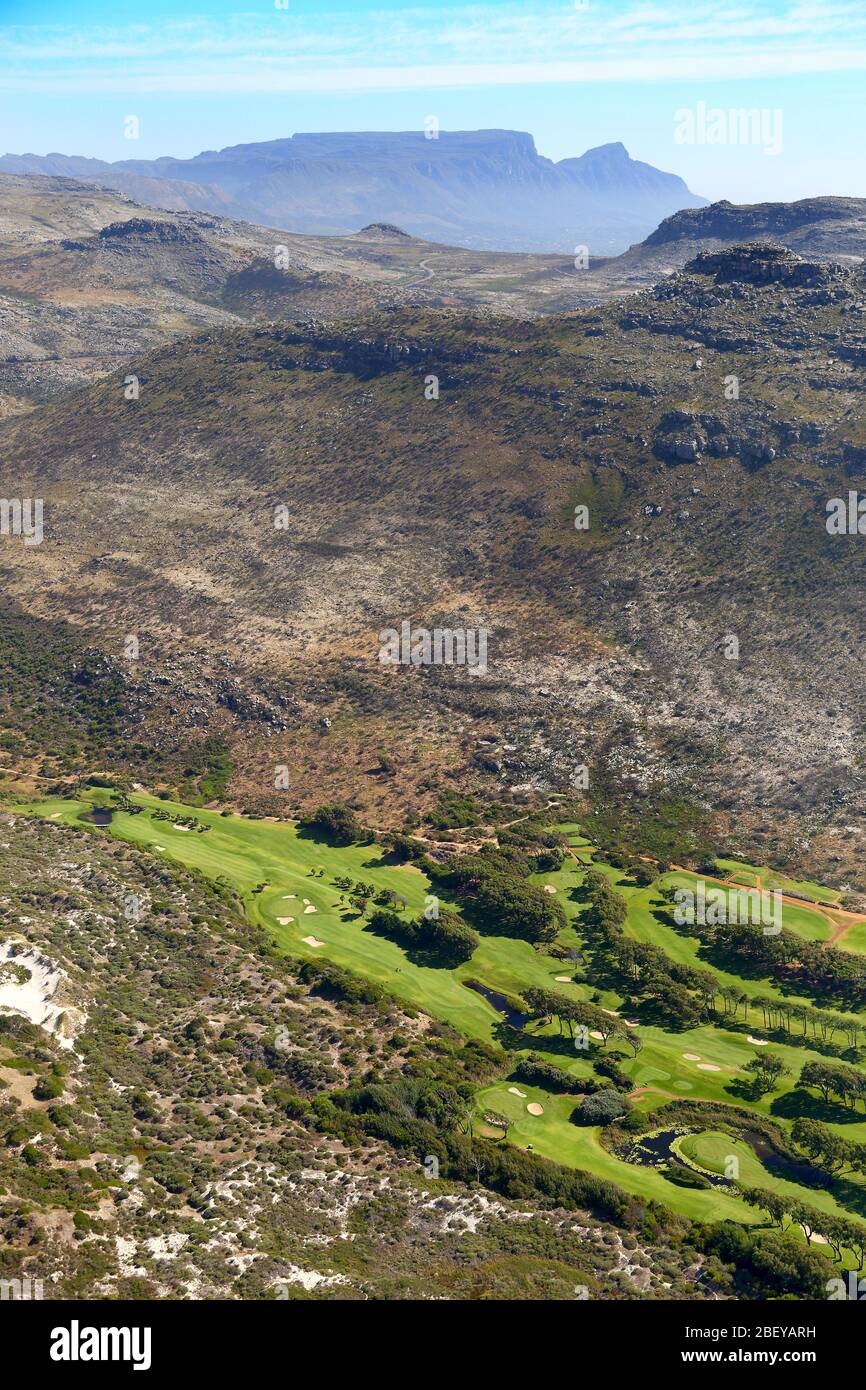 Aerial photo of Clovelly Golf Course with Table Mountain in the ...