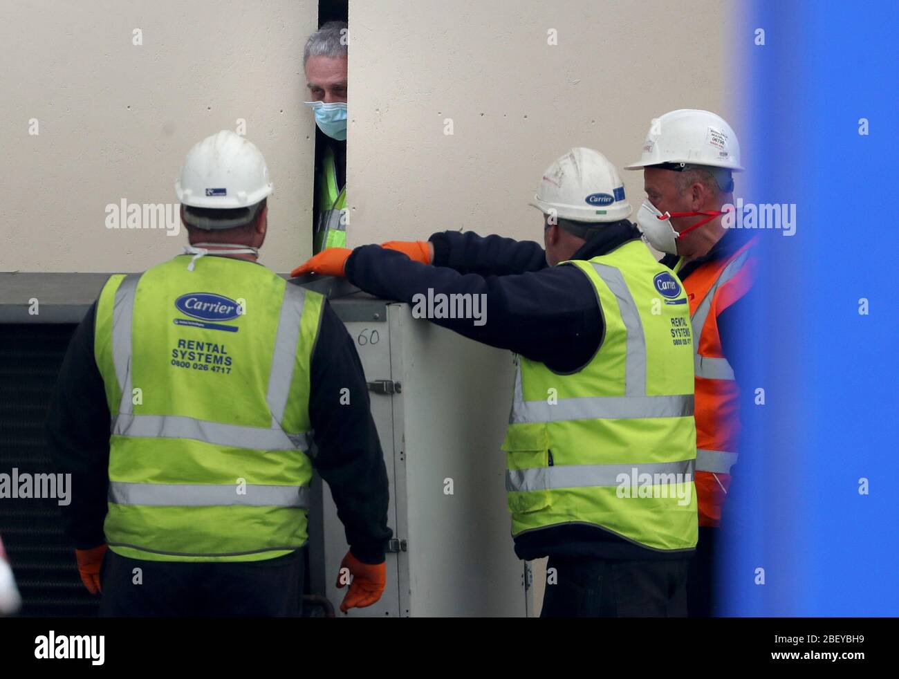 Work continues at the construction of a temporary morgue at an ...