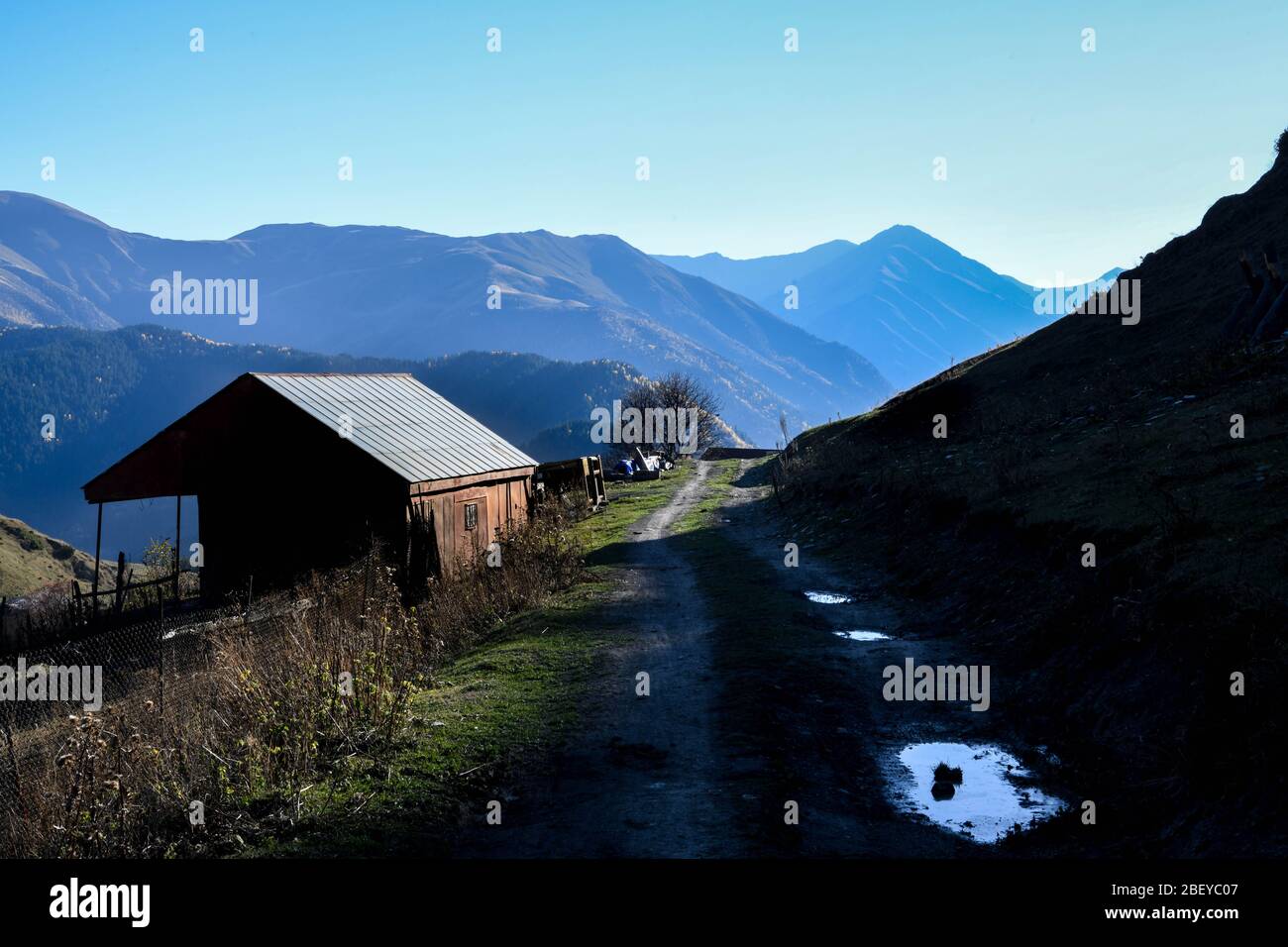 Caucasus, Georgia, Tusheti region, Omalo. A pathway crosses a house in ...