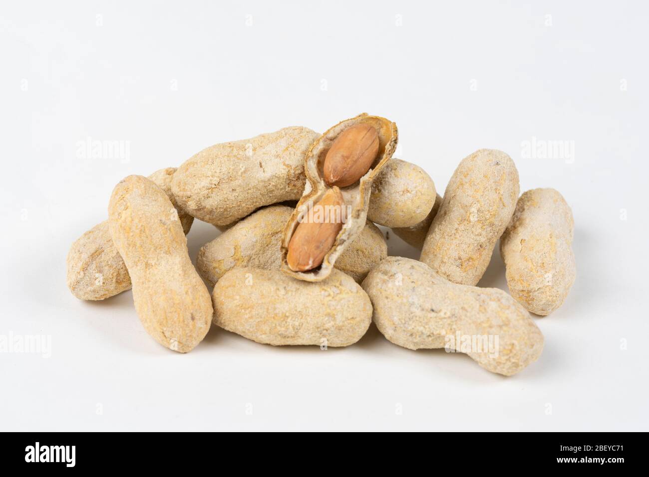 Shelled salted peanuts in shell on white background Stock Photo - Alamy
