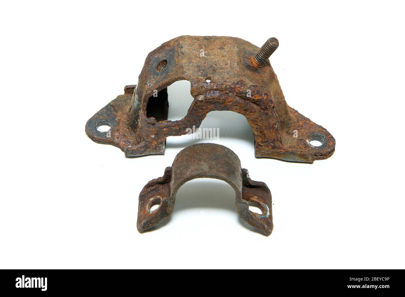 The overgrown rusty cast iron parts isolated in a white background ...