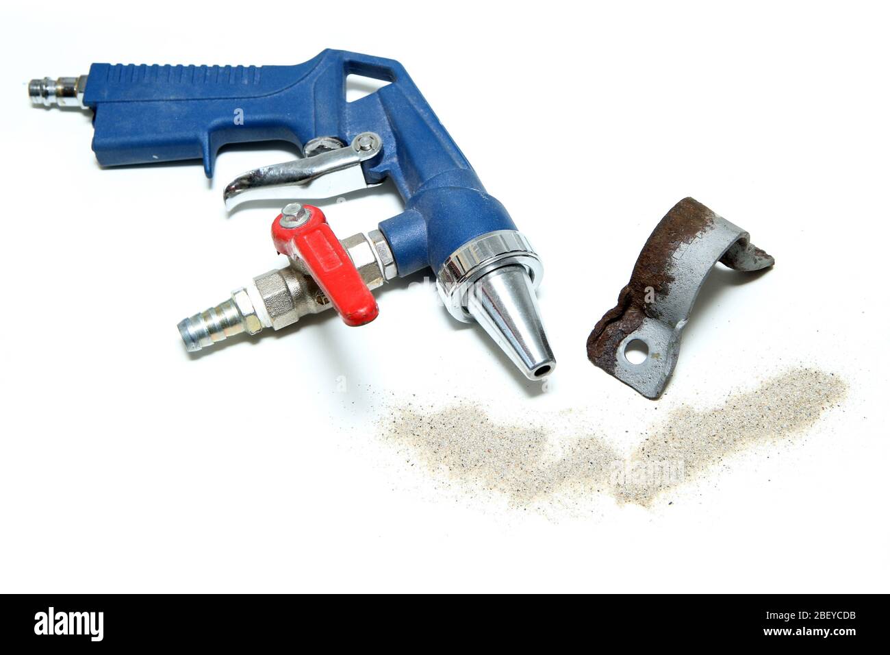 The overgrown rusty cast iron part partly sand blasted together with ...