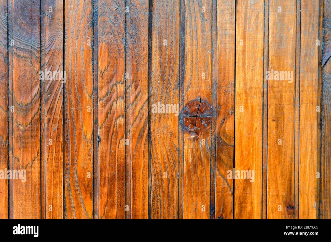Varnished boards. Wooden shield made of yellow varnished boards. The ...