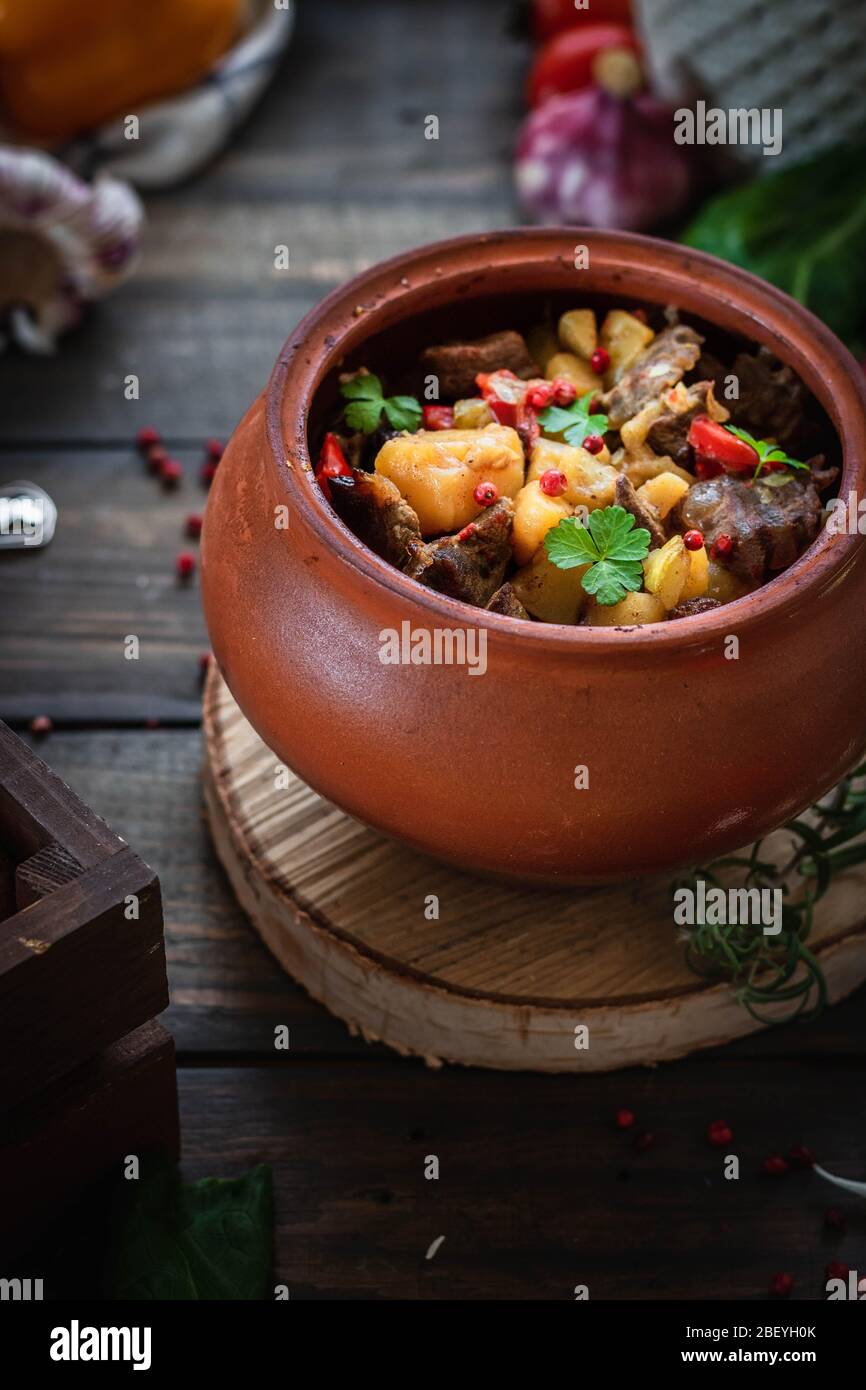 Roast in a clay pot in a rustic style. Braised beef with vegetables ...