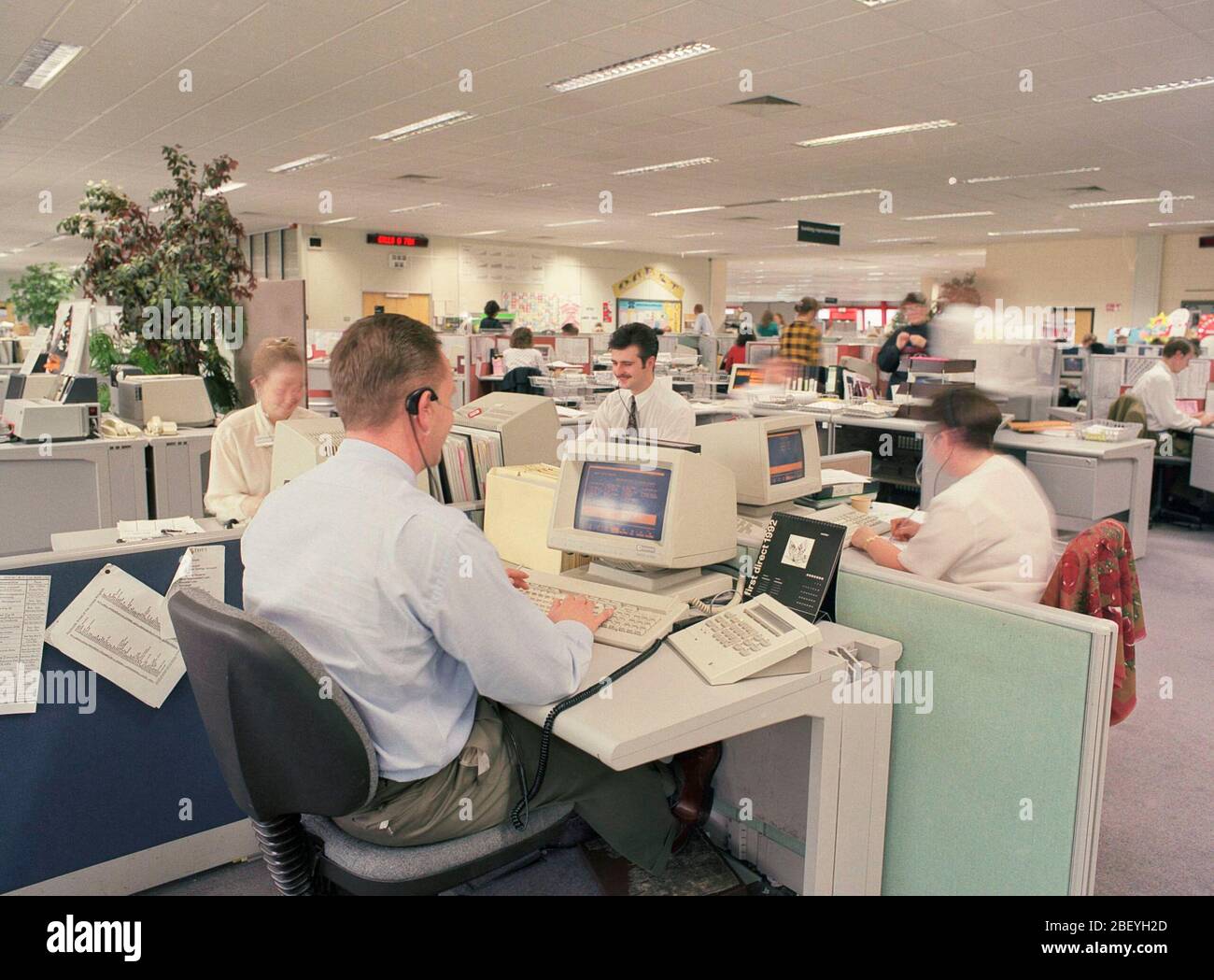 Office people at work in telephone banking call centre, UK, in 1992 ...