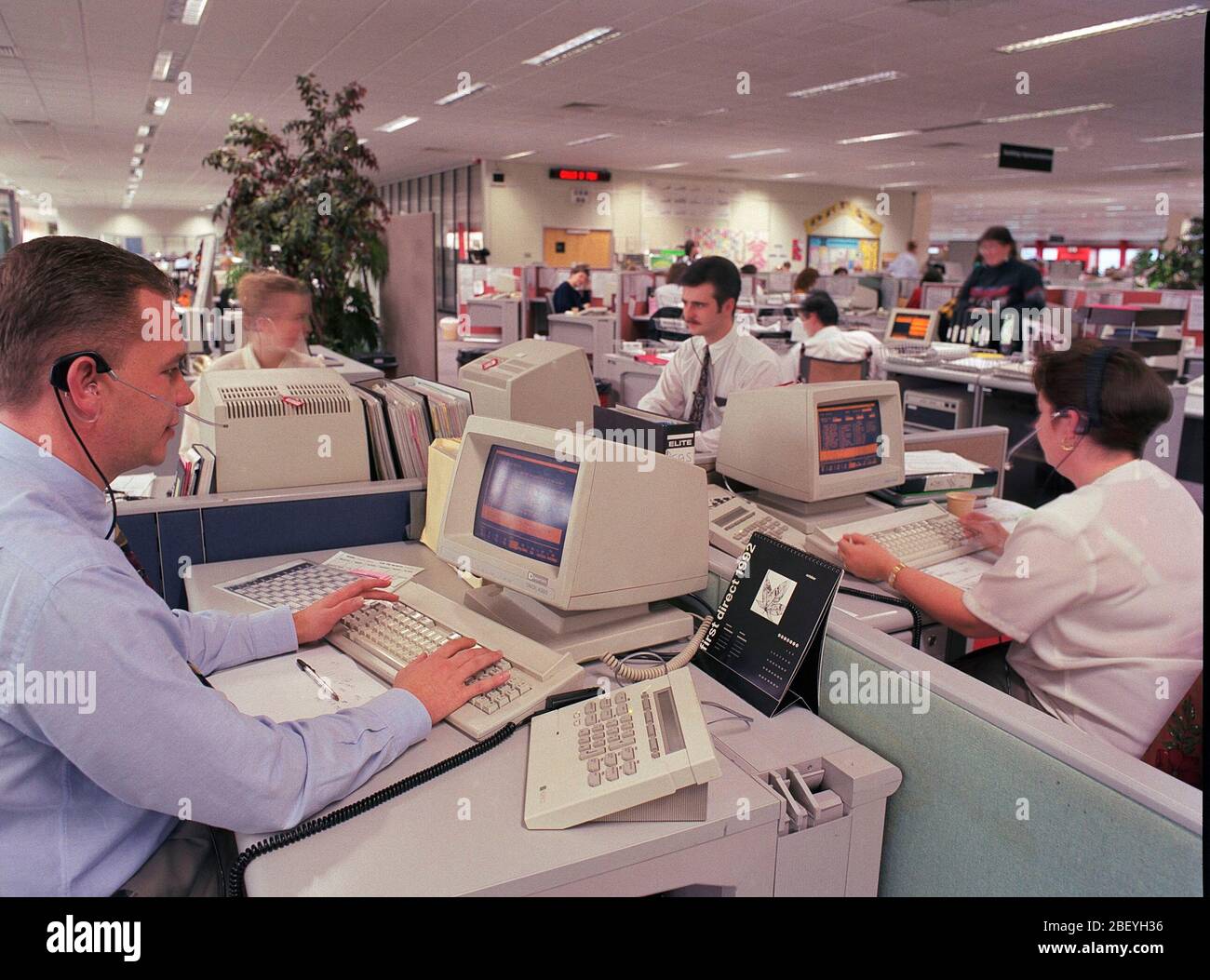 Office people at work in telephone banking call centre, UK, in 1992 ...