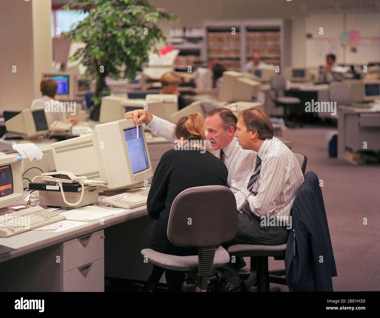Office people at work in telephone banking call centre, UK, in 1992 ...