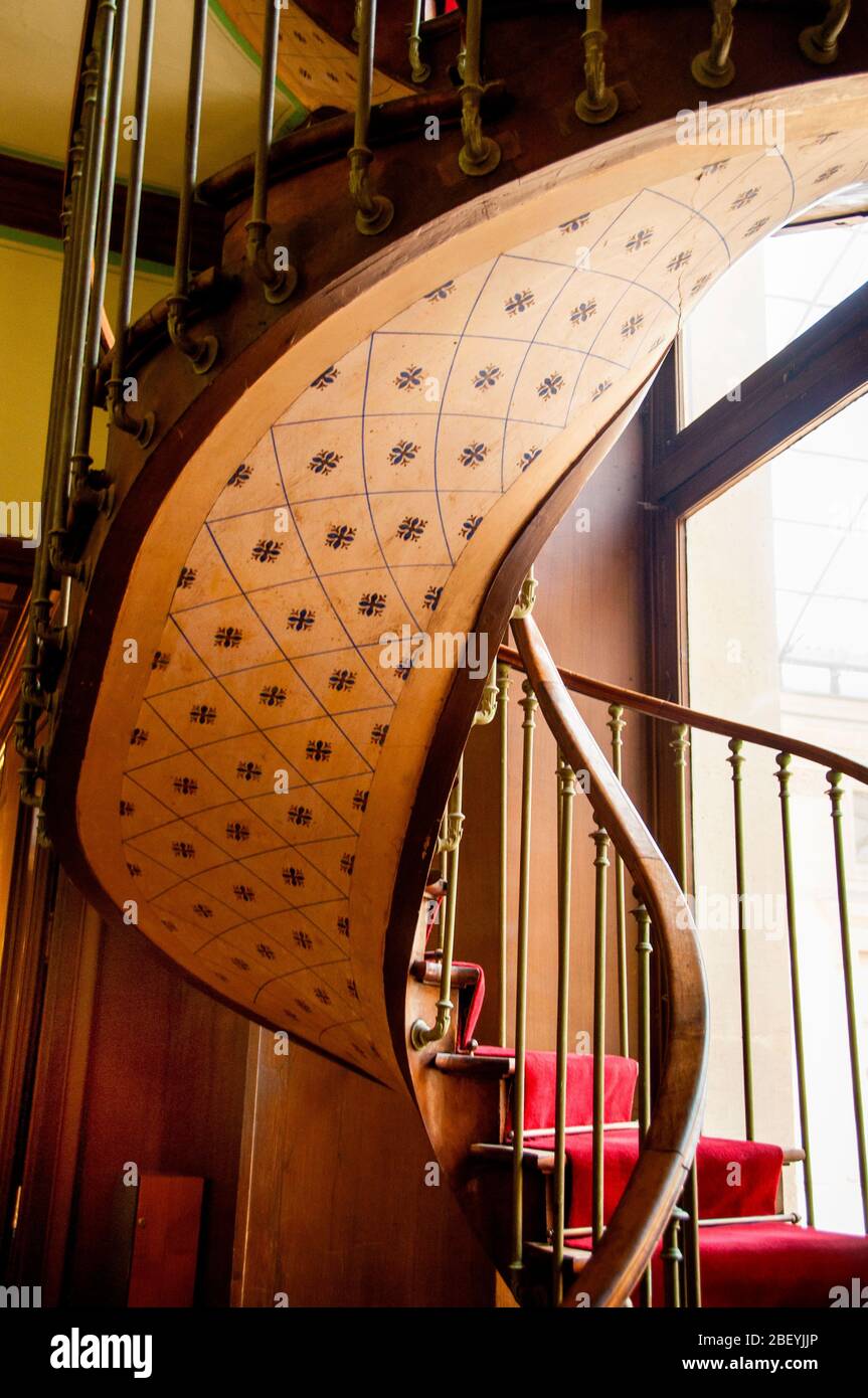 Spiral wooden staircase at the Louvre Museum trimmed underneath in and ...