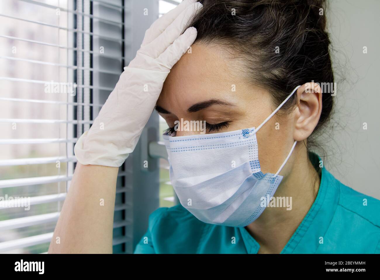 Italian Tired exhausted doctor with medical surgical mask on her Face ...