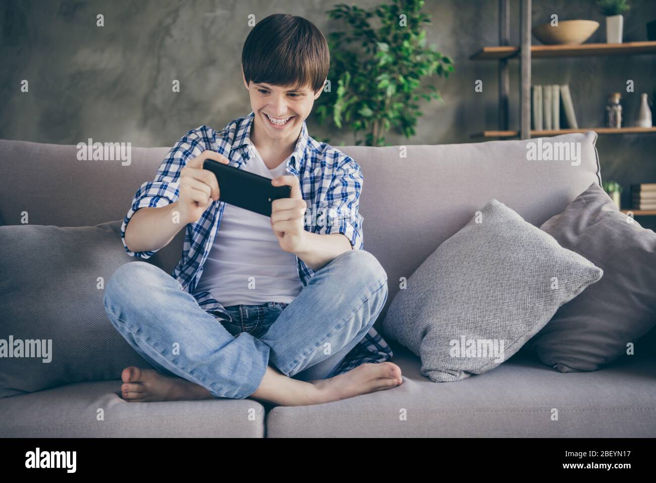 Teenager boy kid barefoot hi-res stock photography and images - Alamy