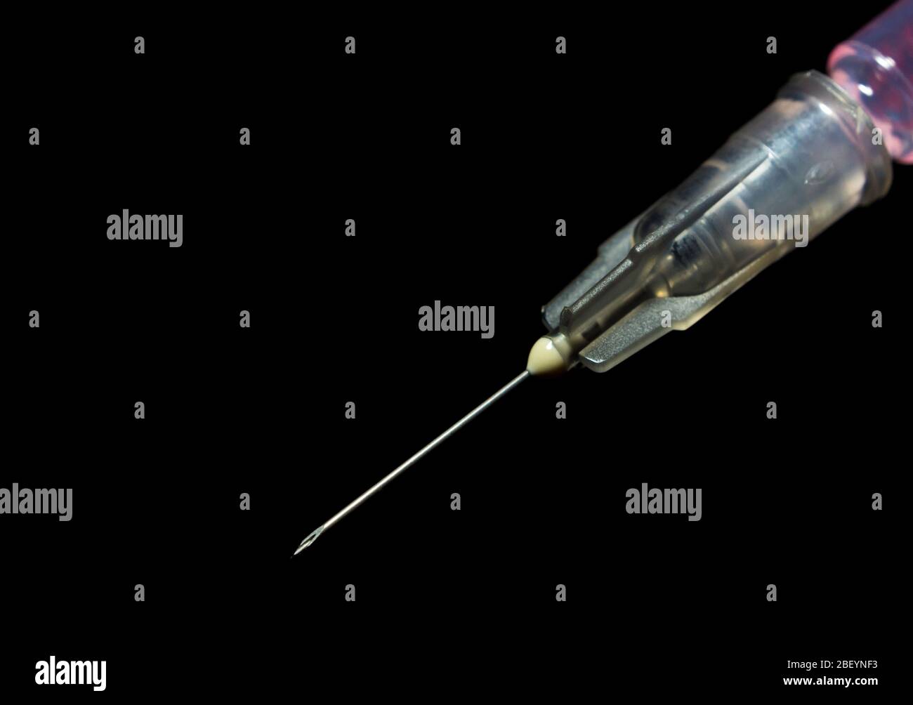 Sharp needle of syringe, injection on black background Stock Photo - Alamy