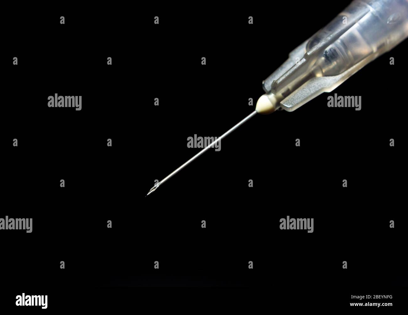 Sharp needle of syringe, injection on black background Stock Photo - Alamy