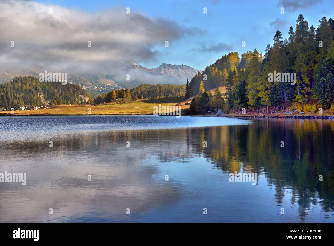 Mountain lake at sunrise in autumn. Landscape with lake, gold sunlight ...