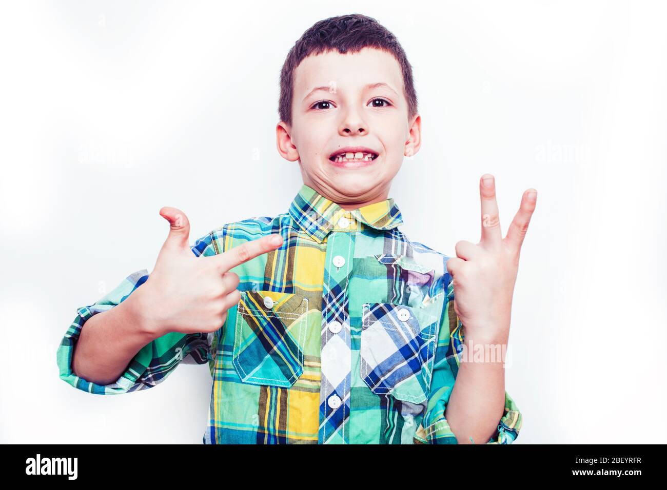 little cute real boy on white background gesture smiling close up ...