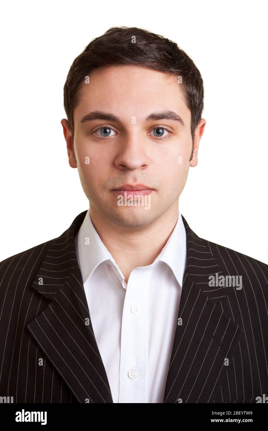 Frontal portrait of a serious looking businessman Stock Photo - Alamy