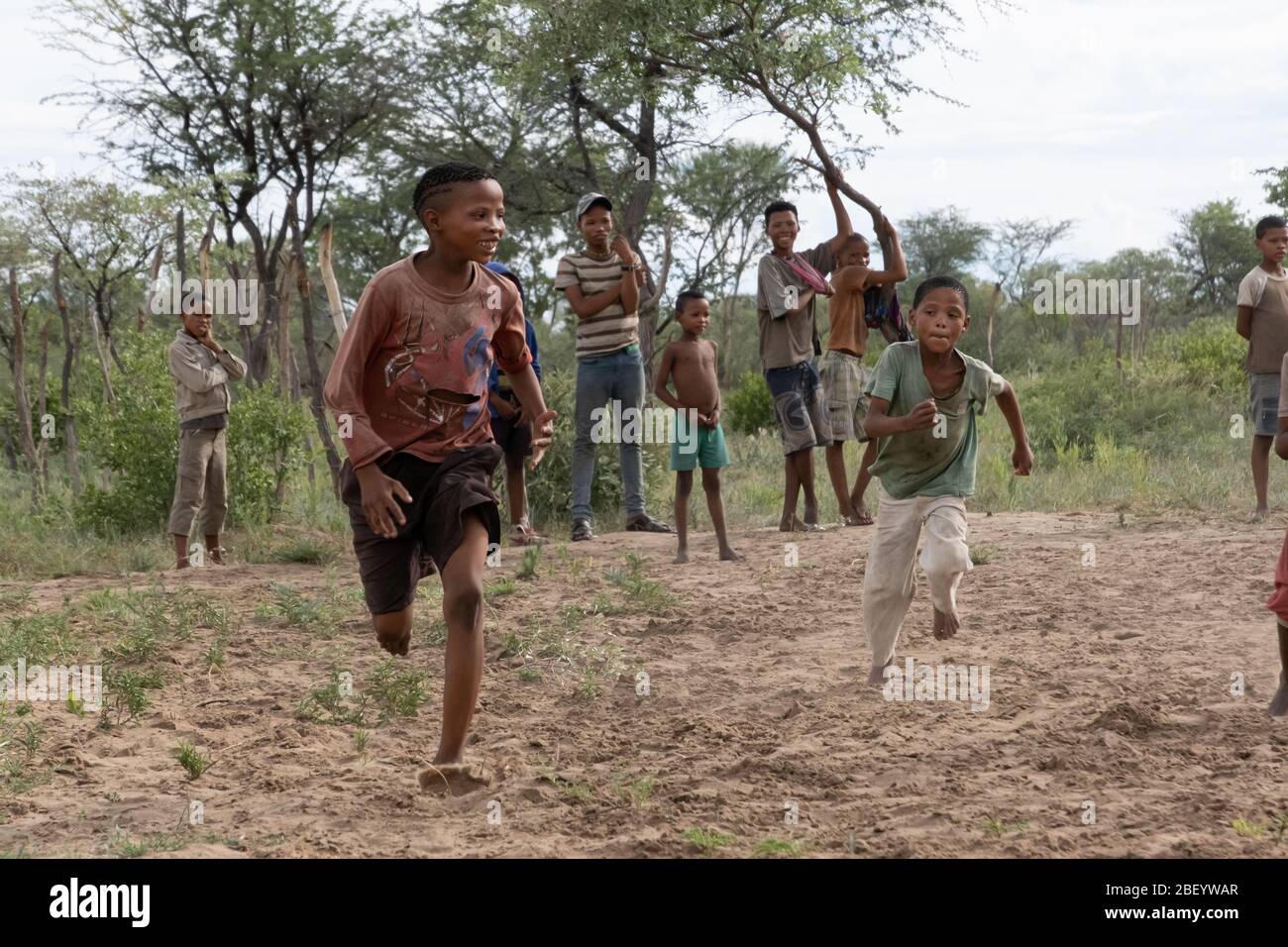 Young boys play in the dust. Nyae Nyae, Namibia Stock Photo - Alamy