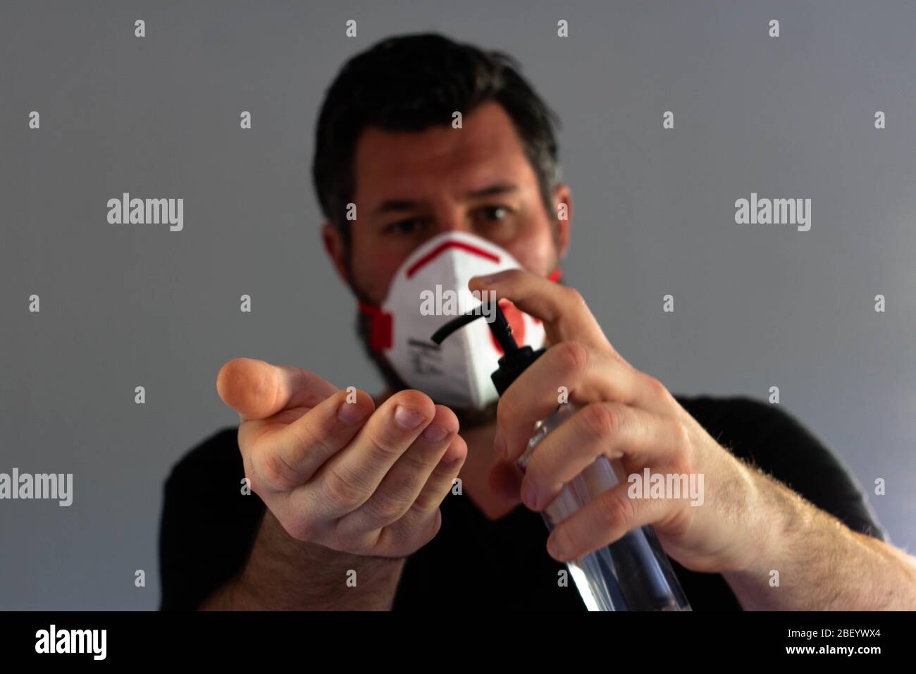 Man wearing a FFP3 hygiene mask to protect against corona virus while ...
